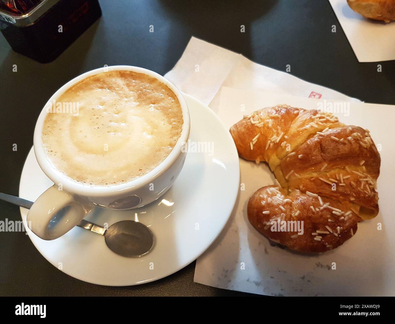 An Italian breakfast with croissant and creamy cappuccino Stock Photo ...
