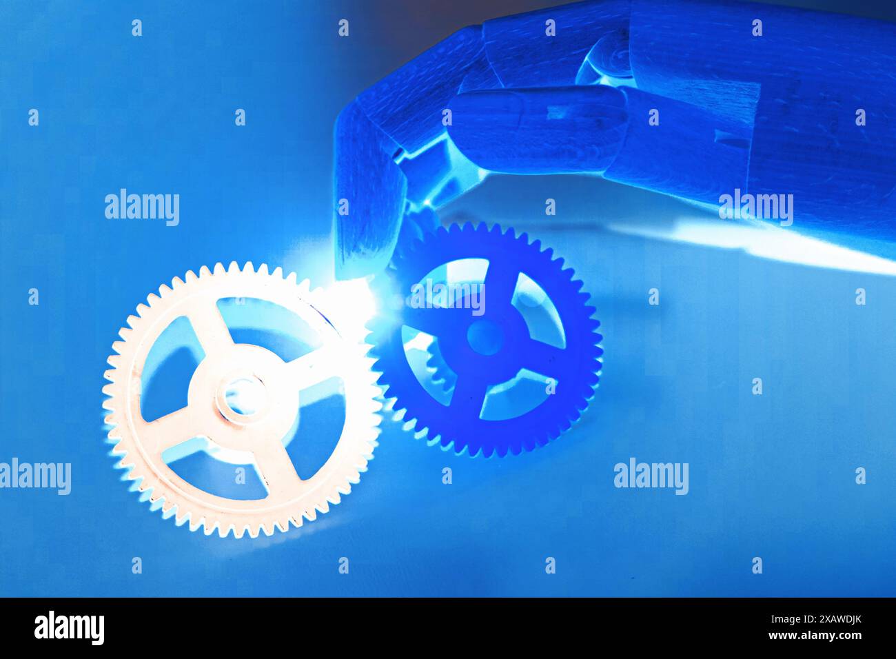 Robotics hand with gears, on blue background. Innovative industrial ...