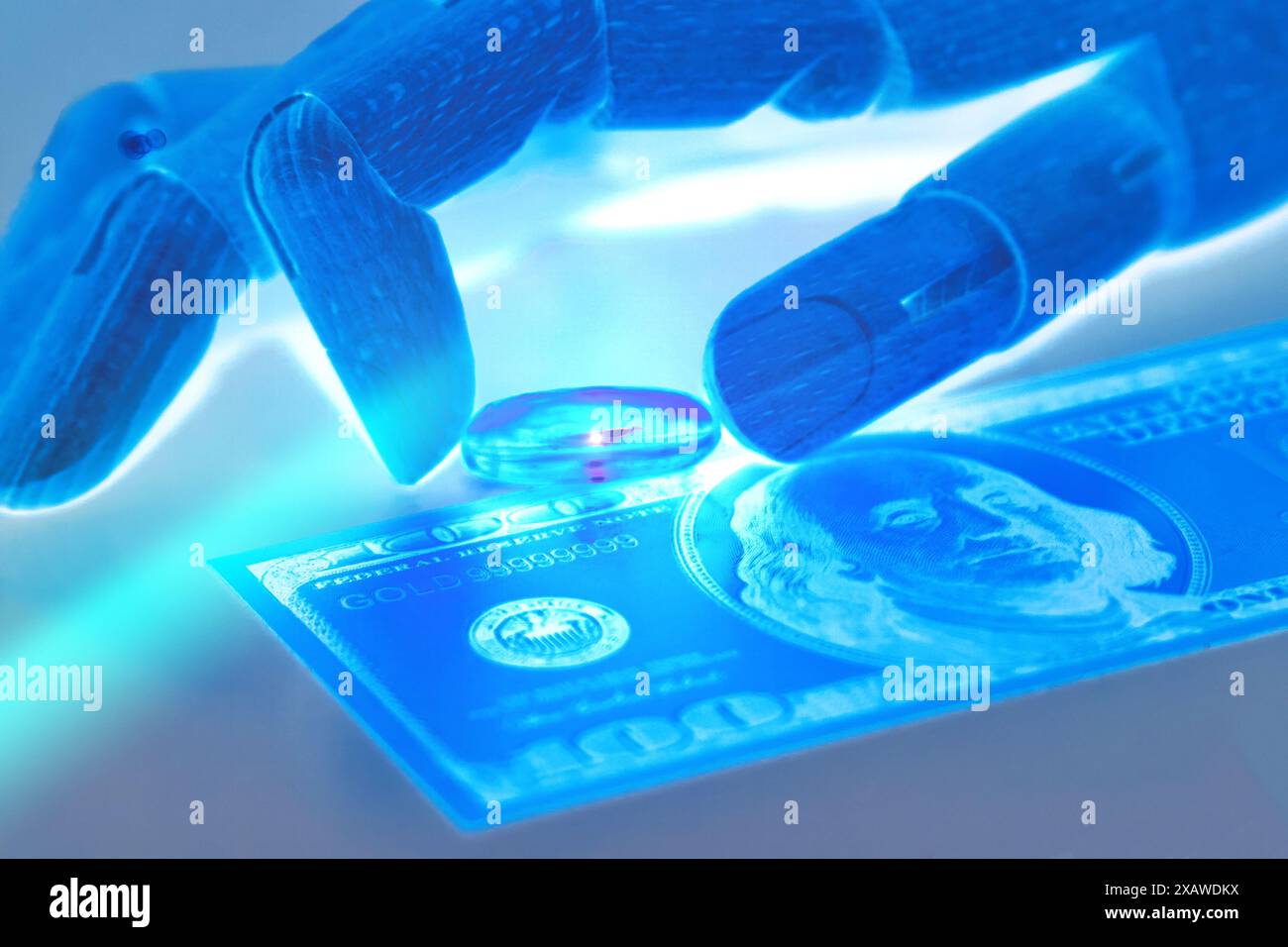 Robot hand holding a Innovations pill laying in a 100 dollar bill. In ...
