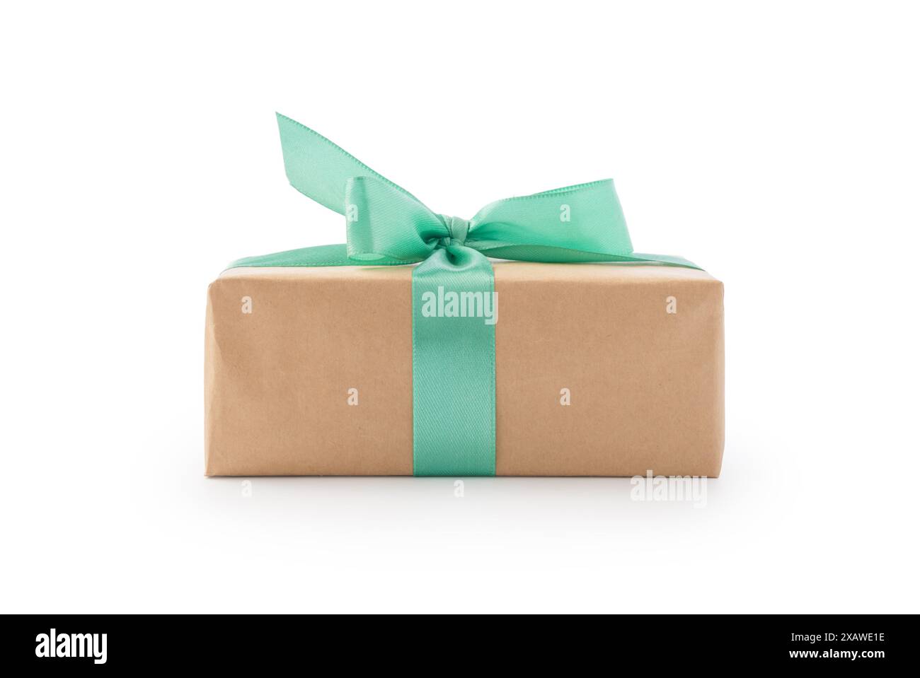 Brown paper gift box with emerald color ribbon isolated on white ...