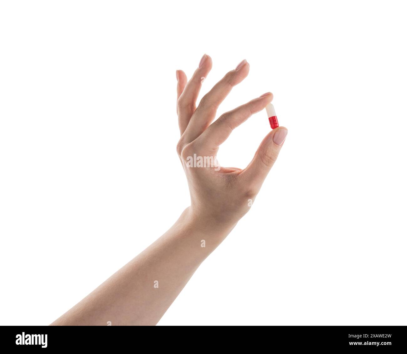 Female hand hold red and white pill isolated on white background Stock ...