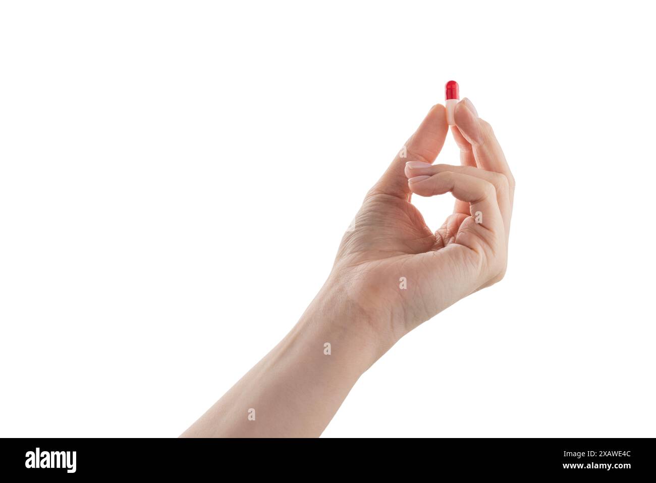 Female hand hold red and white pill isolated on white background Stock ...