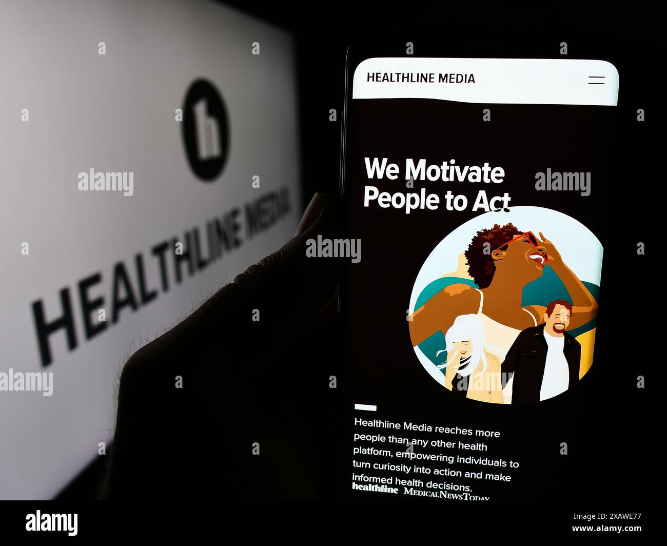 Person holding cellphone with webpage of US health information company ...