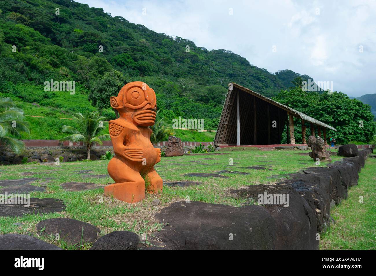 Orange Tiki statue in the ceremonial grounds of Taipivai village, Nuku ...