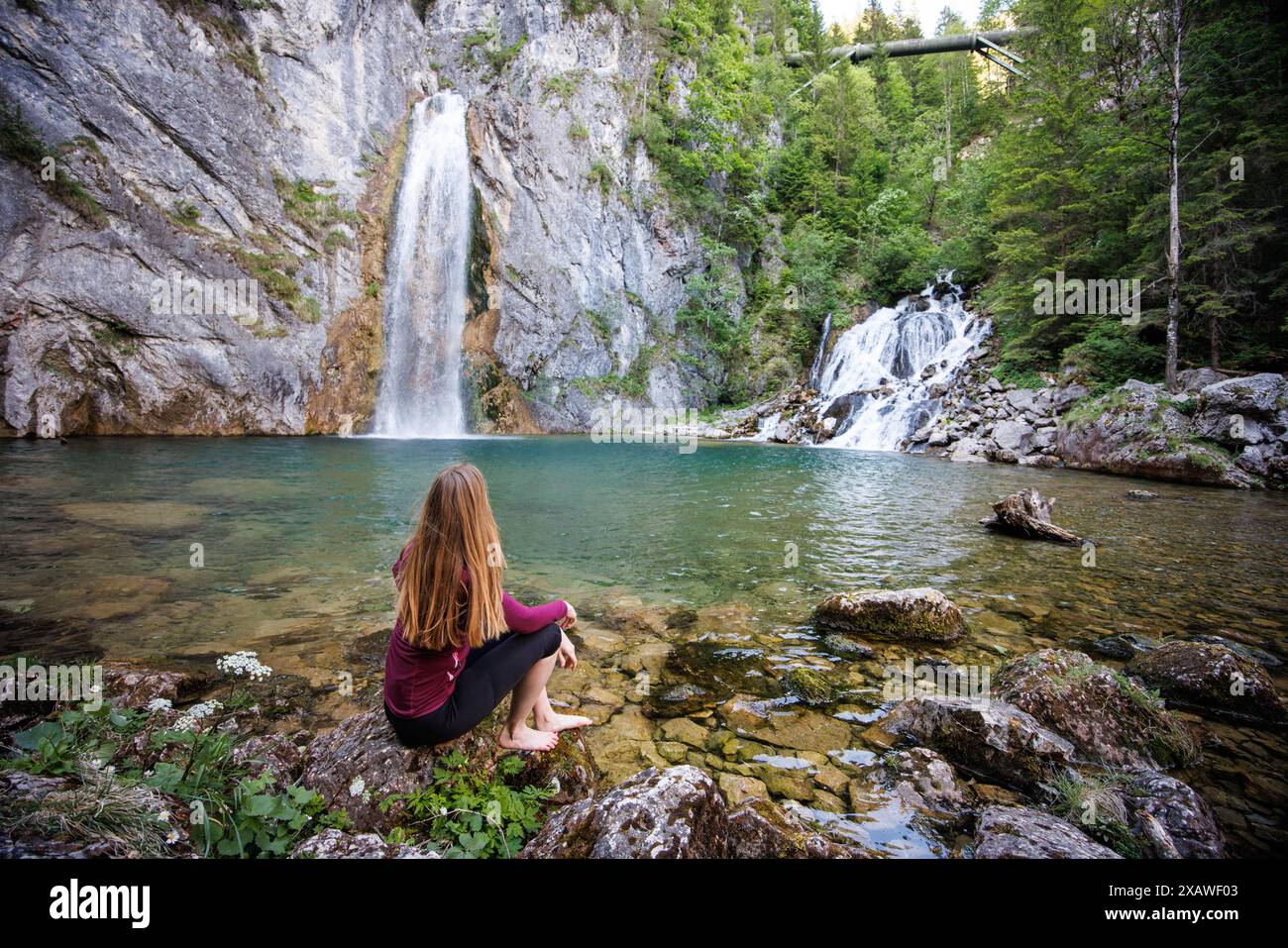 St. Martin Am Grimming, Austria. 20th May, 2024. A young woman sits ...