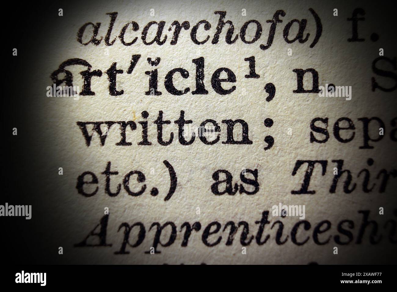 Word article on dictionary page, macro close-up Stock Photo - Alamy