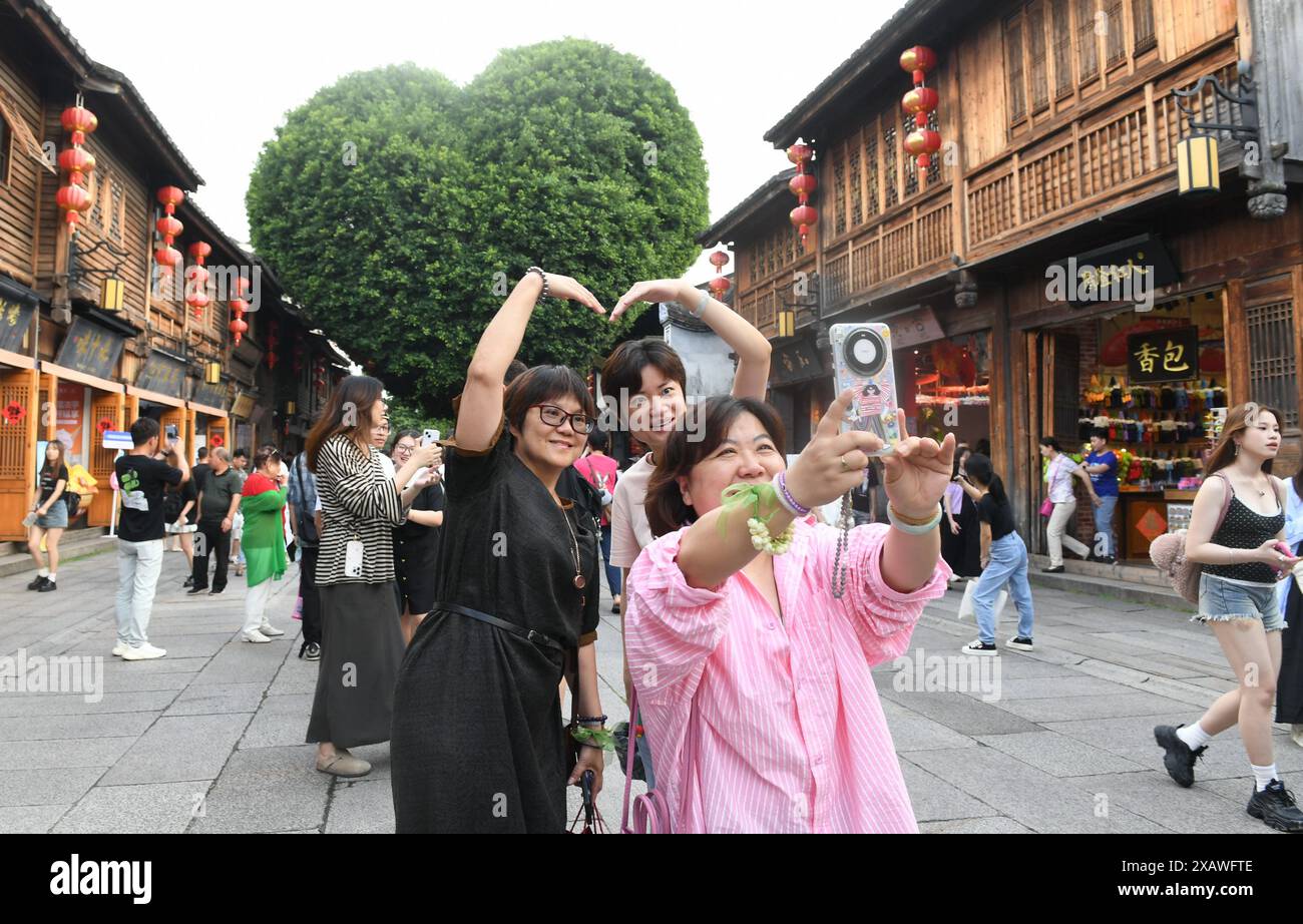 Fuzhou, China's Fujian Province. 7th June, 2024. Tourists pose for ...