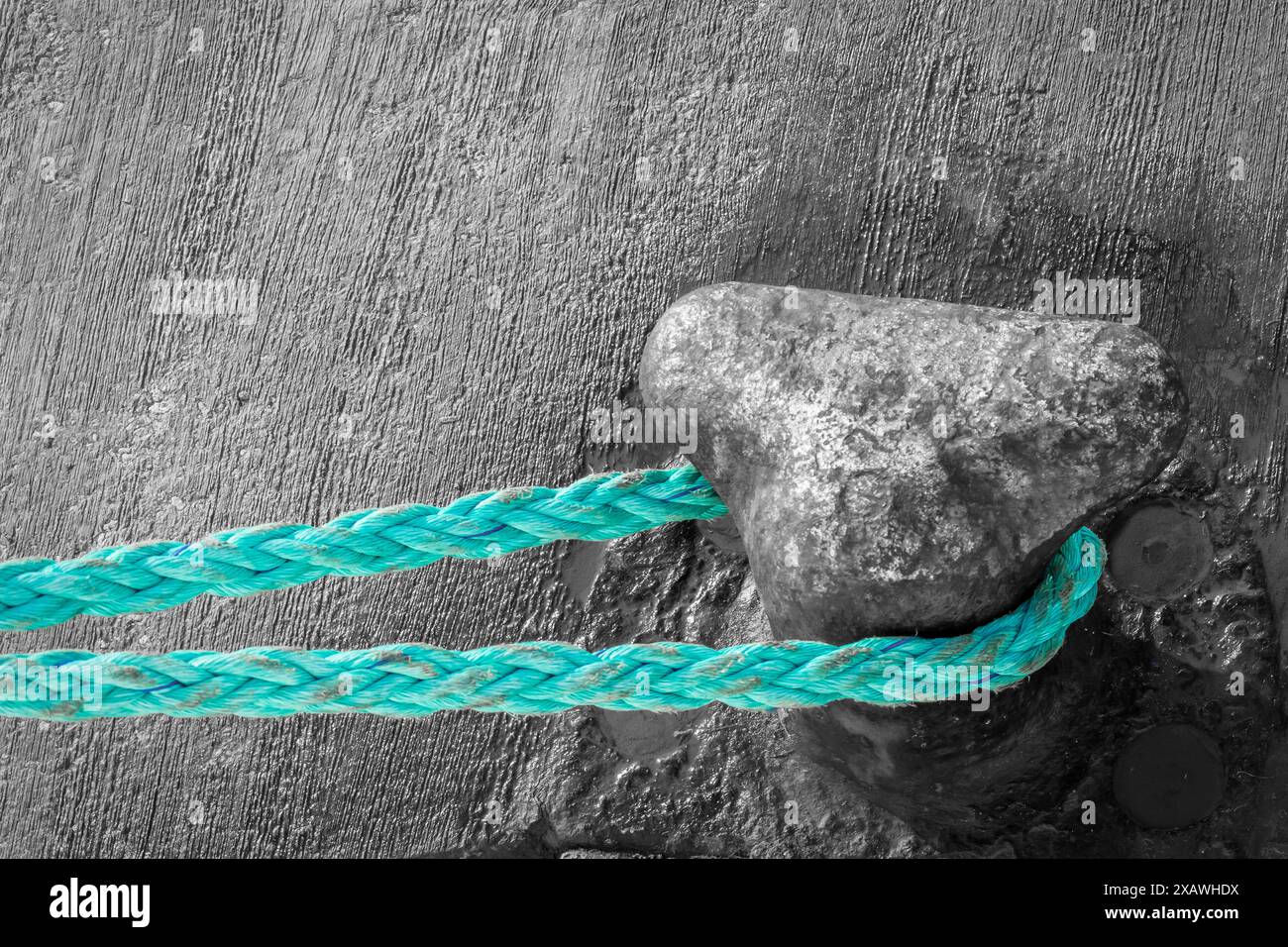 turquoise-colored rope on the beach with a black-and-white background ...