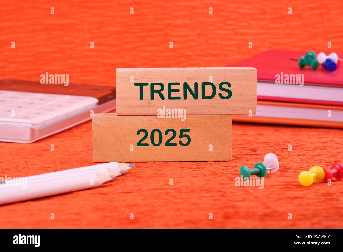 2025 trend concept. TRENDS 2025 on a wooden block in a composition with ...