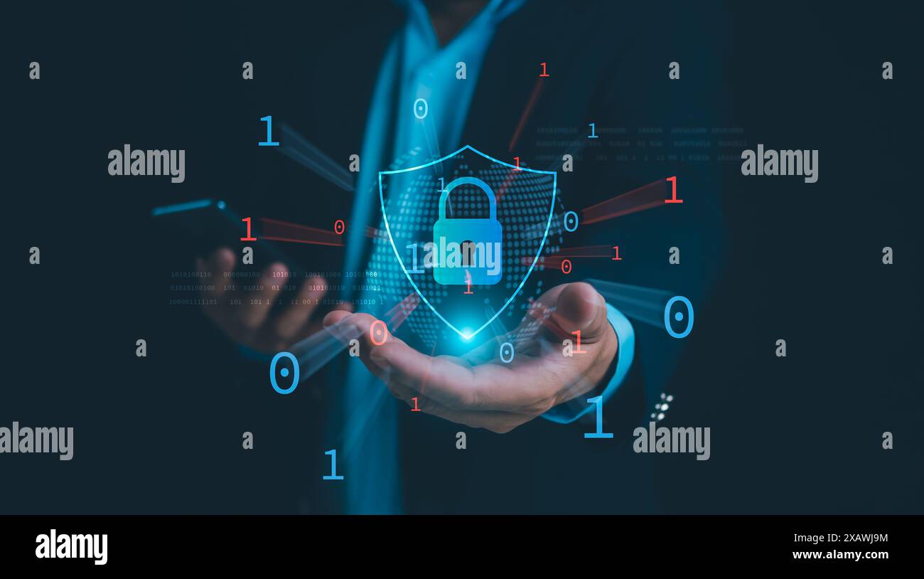 Businessman showing key and symbolic shield represents protection ...