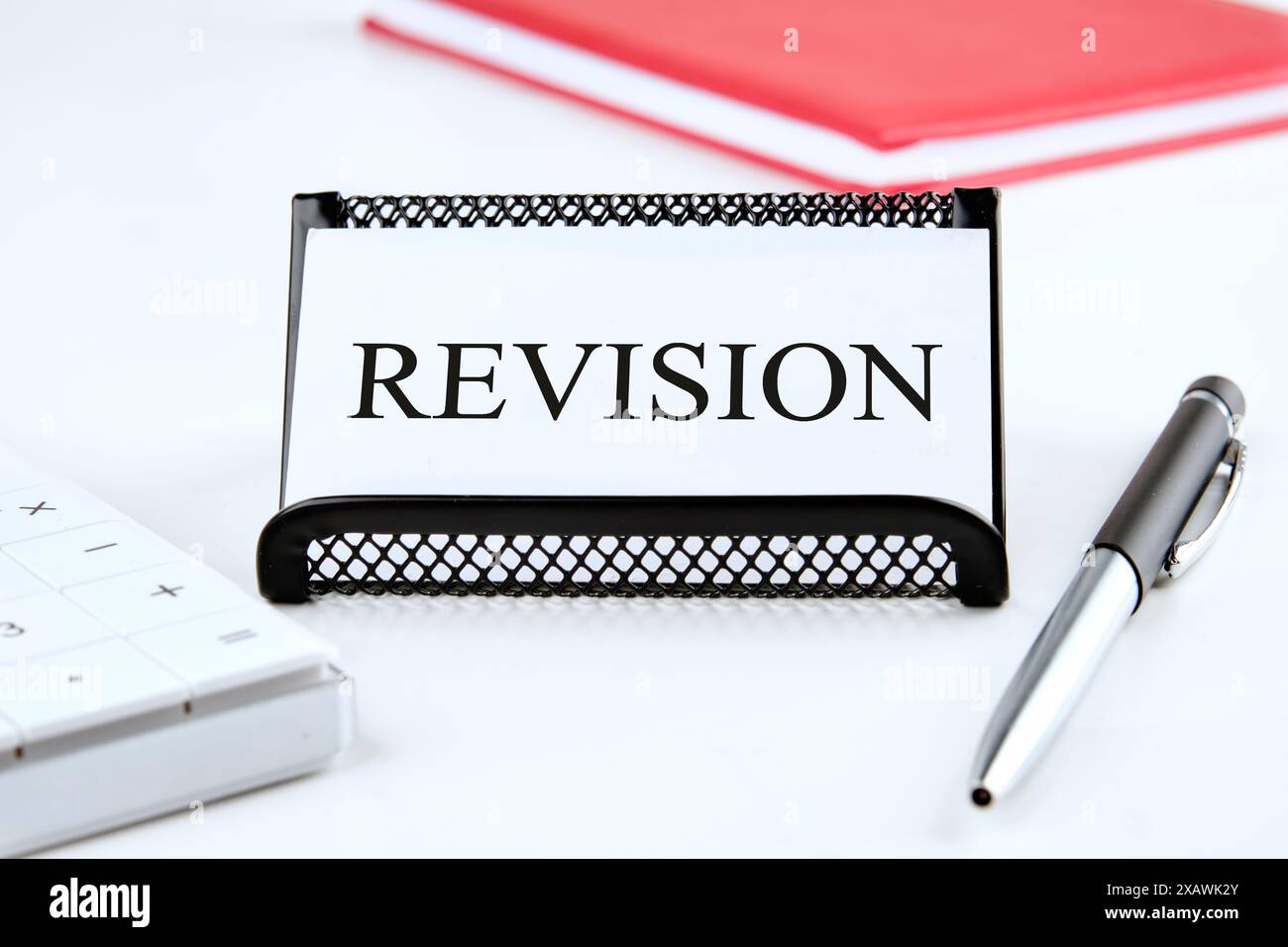 Concept Word REVISION on a business card on a white background Stock ...