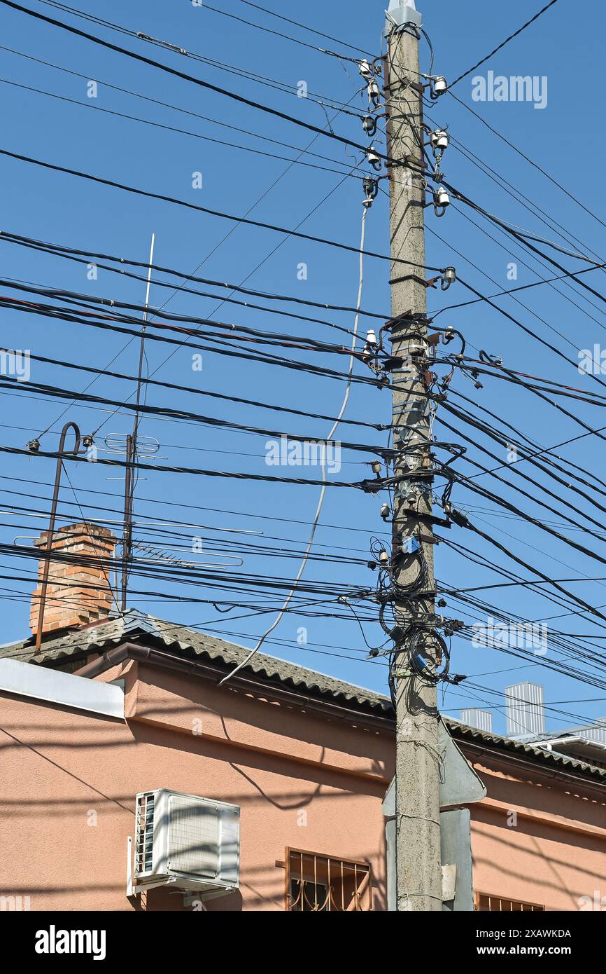 electric wires on a pole, many cables and wires on an electric pole ...