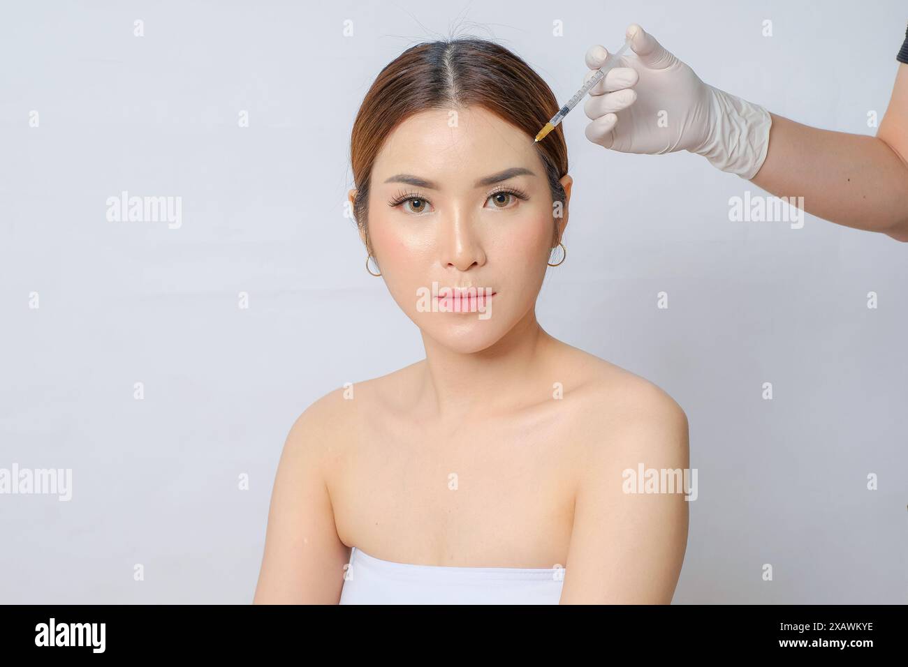 Youthful Charm Asian Woman's Botox Adventure Stock Photo - Alamy