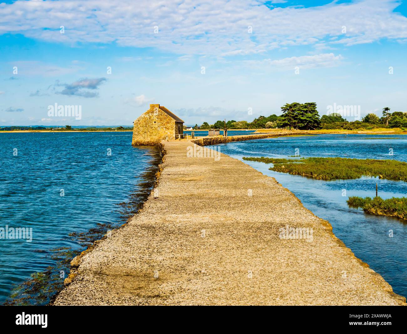 Amazing view of the tide mill and its dike at Arz Island in a bright ...