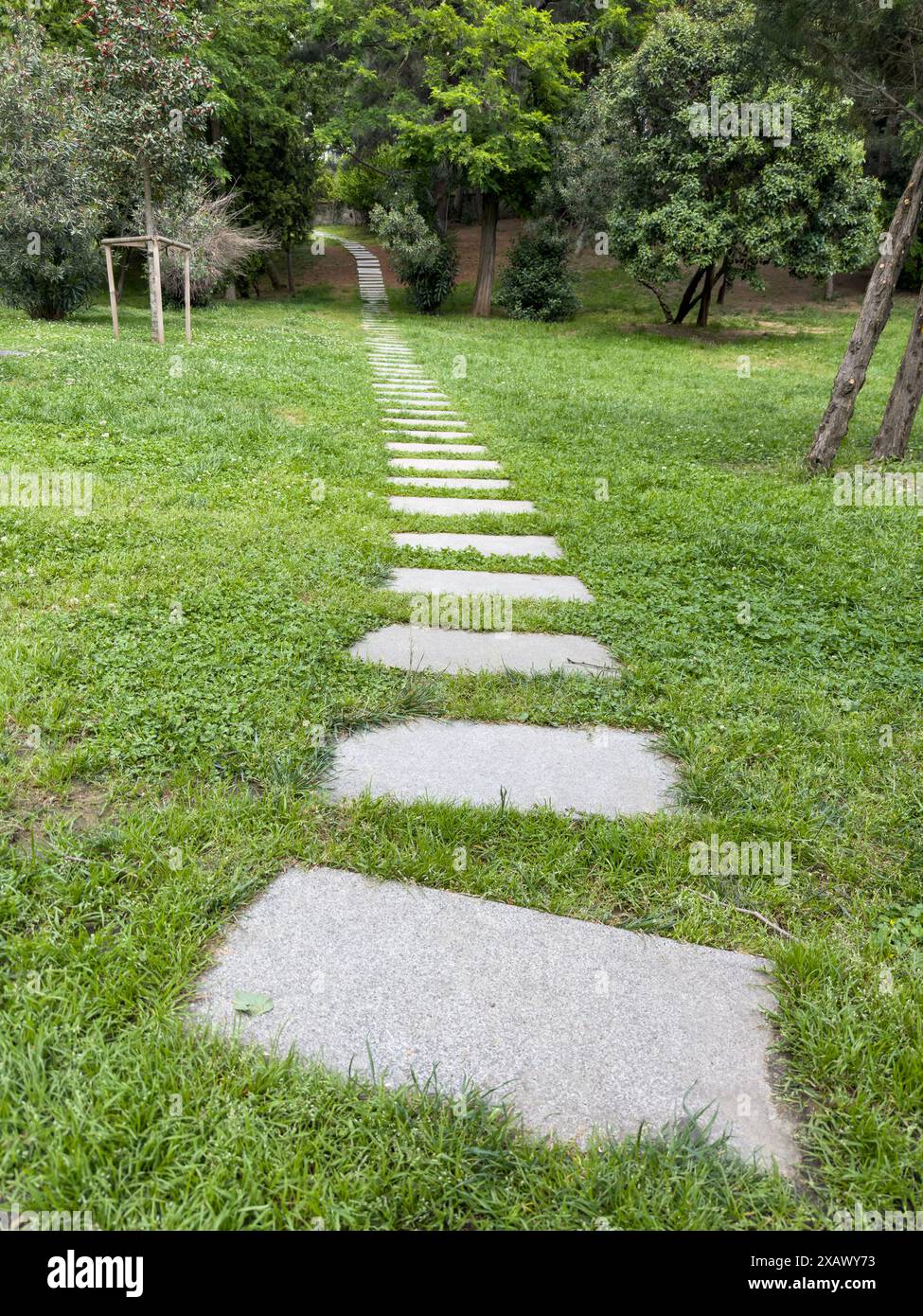 Walkway, cement slabs laying on the grass. Stone slab Pathway on ...