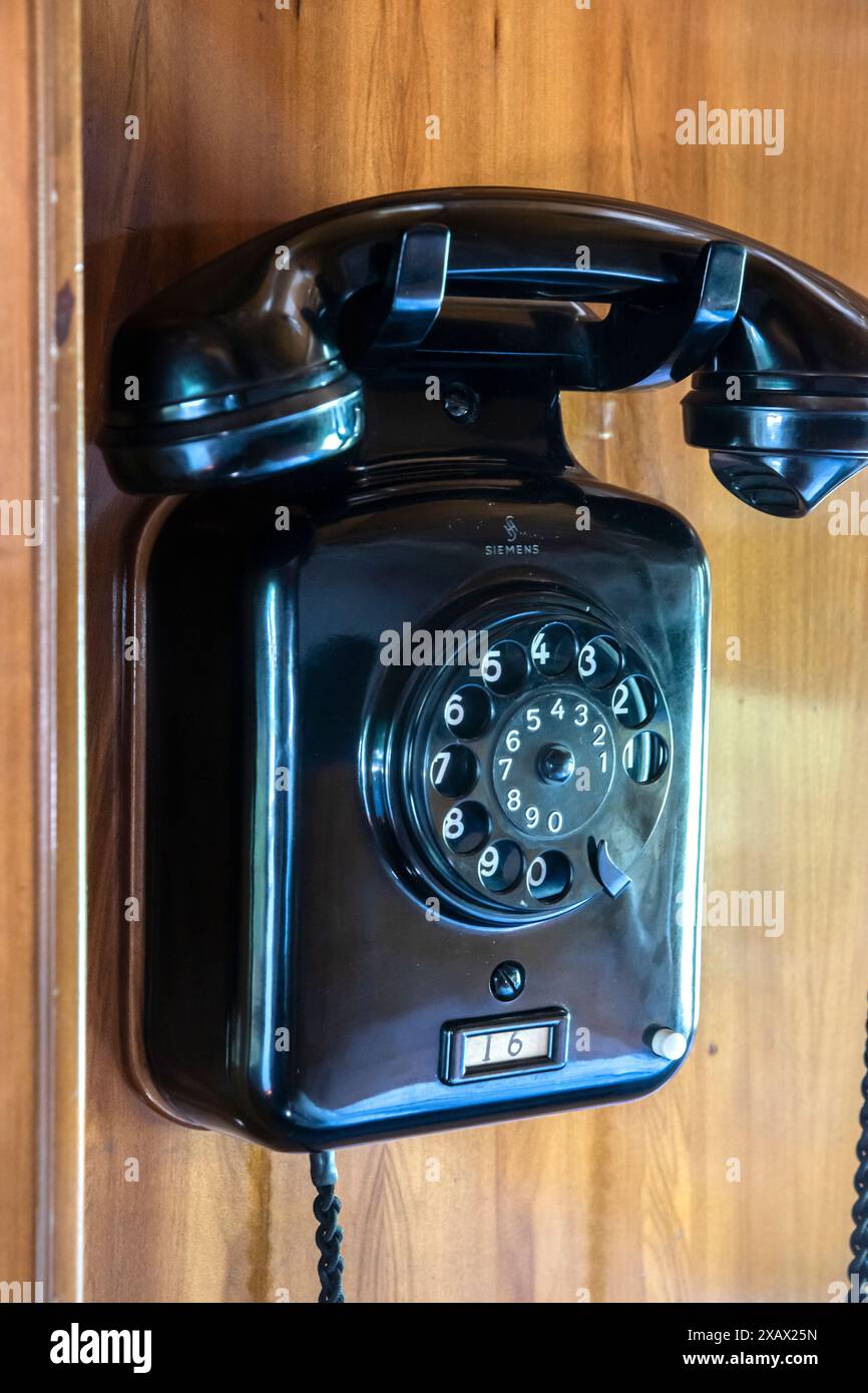 Antique wall telephone closeup in retro train Stock Photo - Alamy