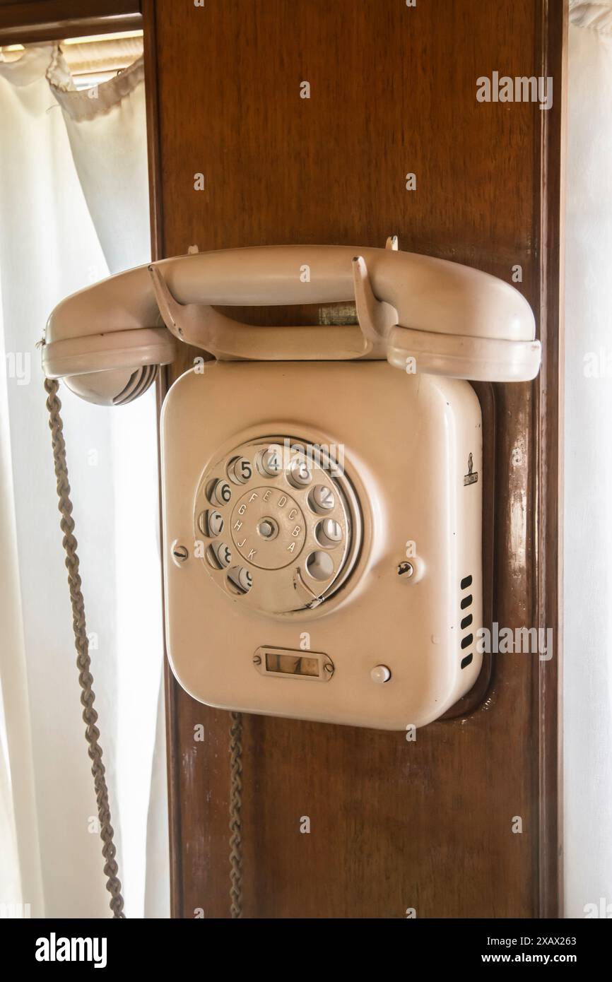 Antique wall telephone closeup in retro train Stock Photo - Alamy