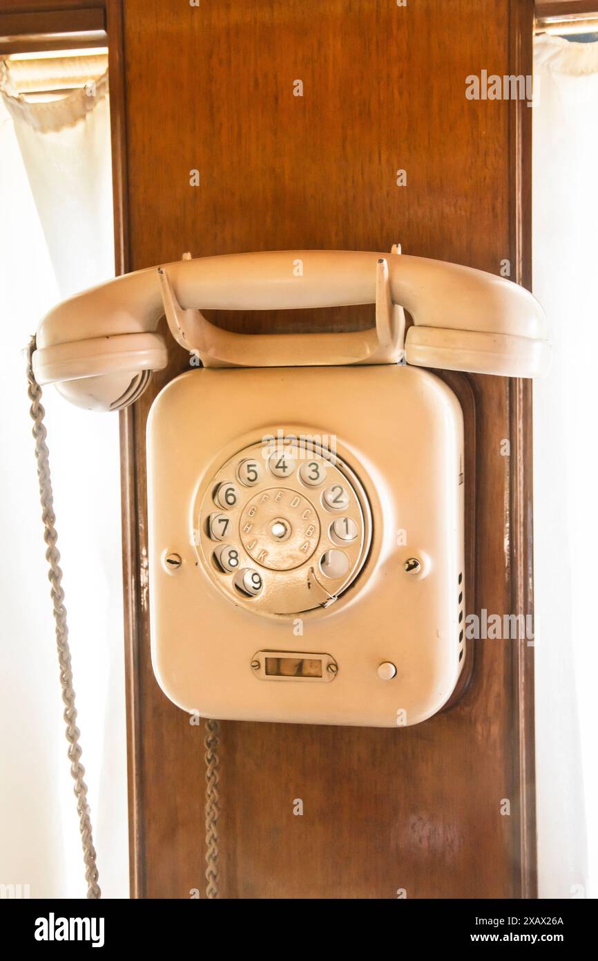 Antique wall telephone closeup in retro train Stock Photo - Alamy