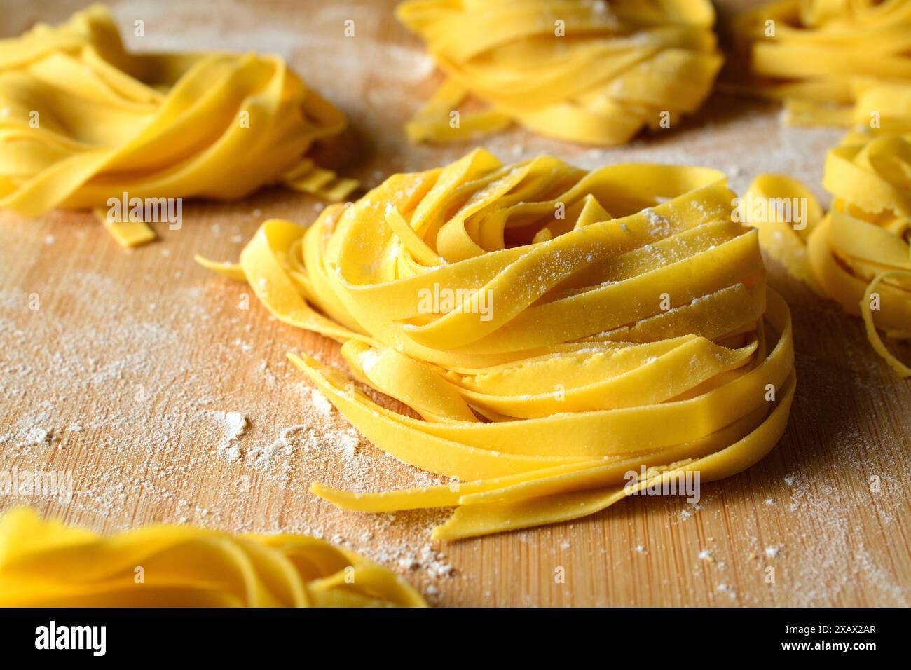 Italian Tagliatelle. Freshly made pasta rolled into a nest Stock Photo ...