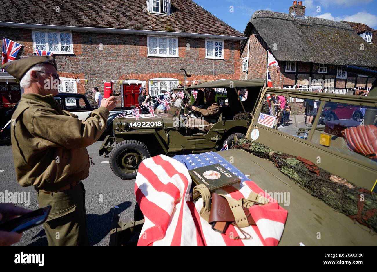 Military vehicles take part in a motorcade along the High street in ...