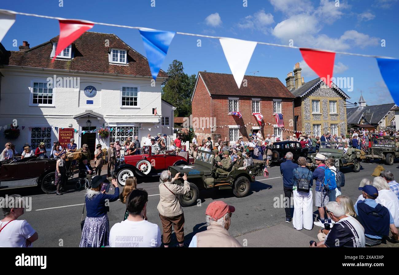 Military vehicles take part in a motorcade along the High street in ...