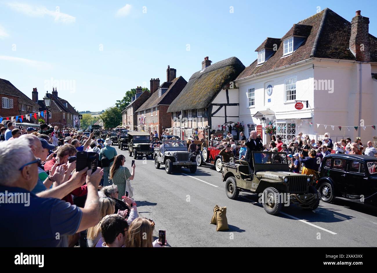Military vehicles take part in a motorcade along the High street in ...