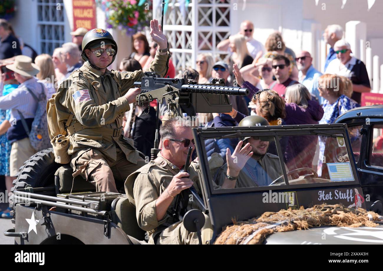 Military vehicles take part in a motorcade along the High street in ...