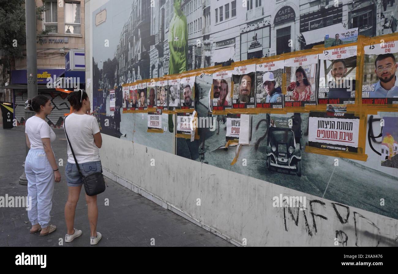JERUSALEM - JUNE 8: Israelis look at posters containing images of ...
