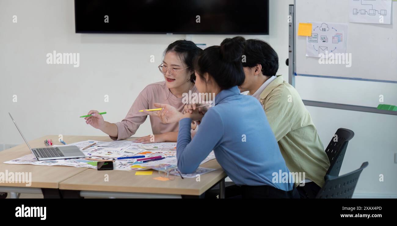 Creative Ux Developer And Ui Designer Team Brainstorming Ideas In Modern Office Setting With