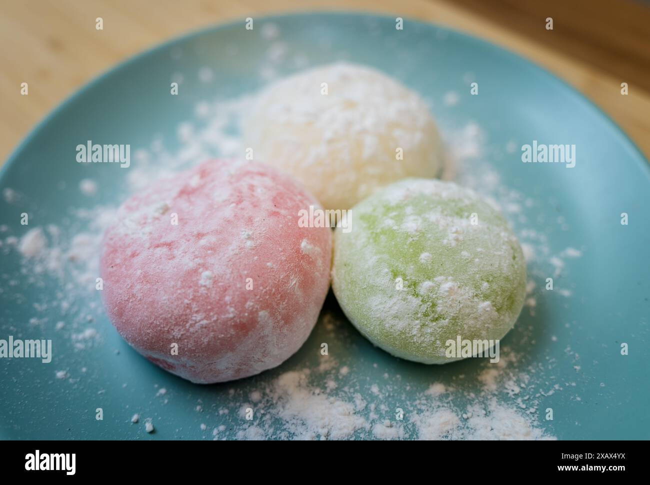 Different color delicious Japanese mochi on the blue plate Stock Photo ...