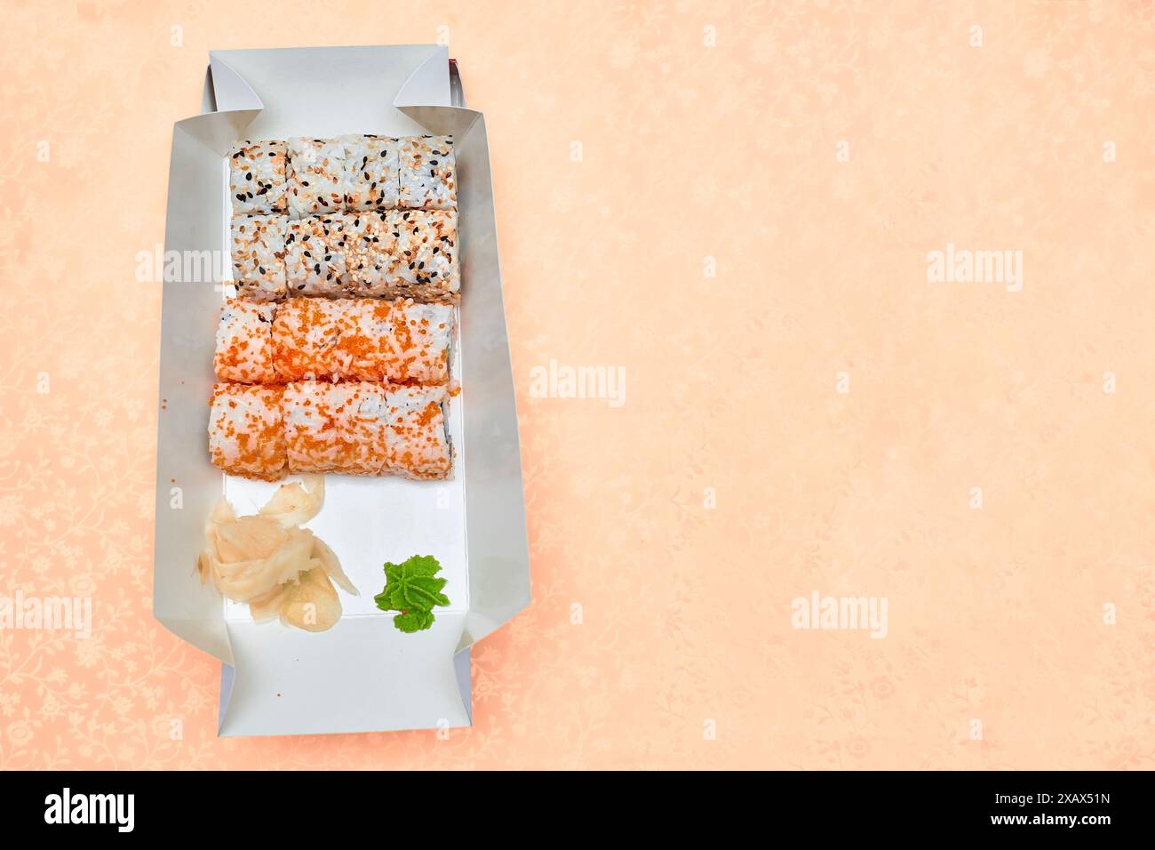 a Japanese dish consisting of small balls or rolls of vinegar-flavored ...