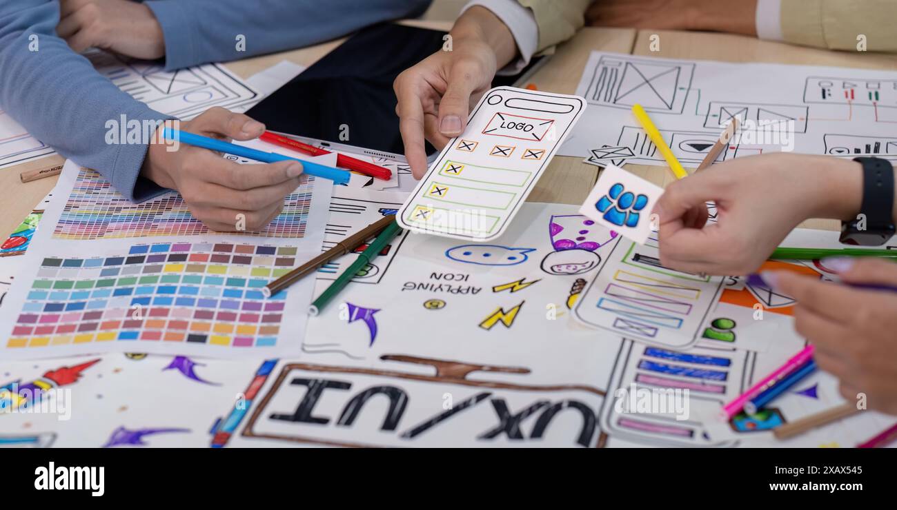 Creative Ux Developer And Ui Designer Brainstorming Session With Color Palettes Wireframes And