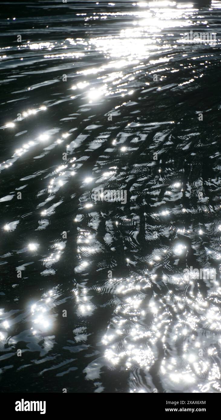 beams of sunlight illuminate the clear blue water, Ideal for marine and ...