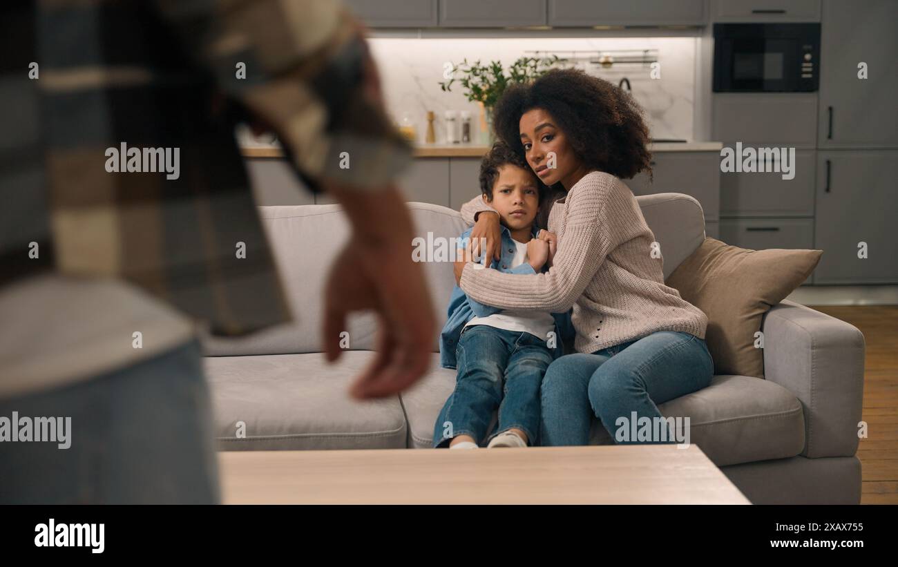 Back view cruel African American father man dad threaten clench fist ...