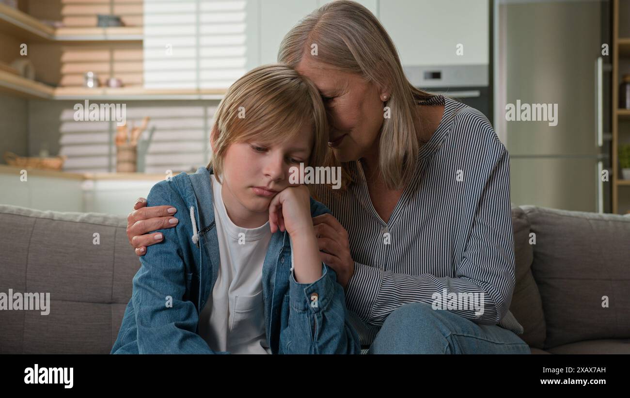 Caring Caucasian grandmother senior elderly woman female calming ...