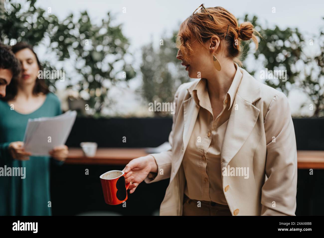 Professional businesswomen during a casual coffee break outdoors Stock ...