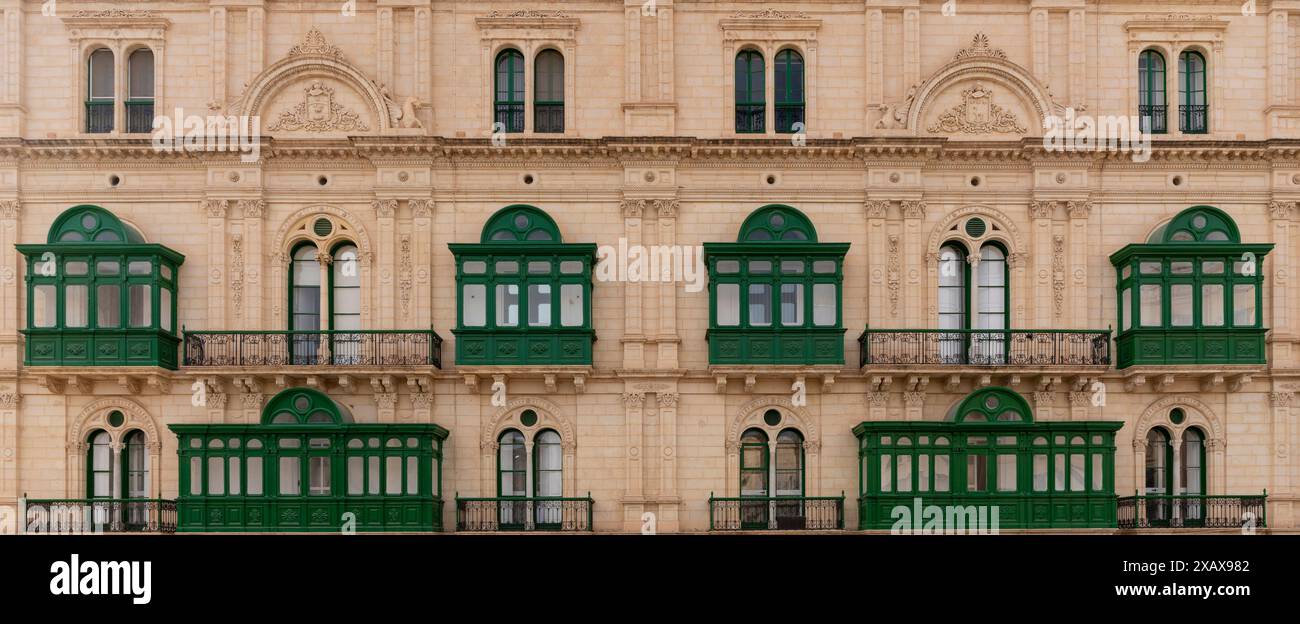 Tipical house wall in Malta. Limestone yellow bricks and colorful ...