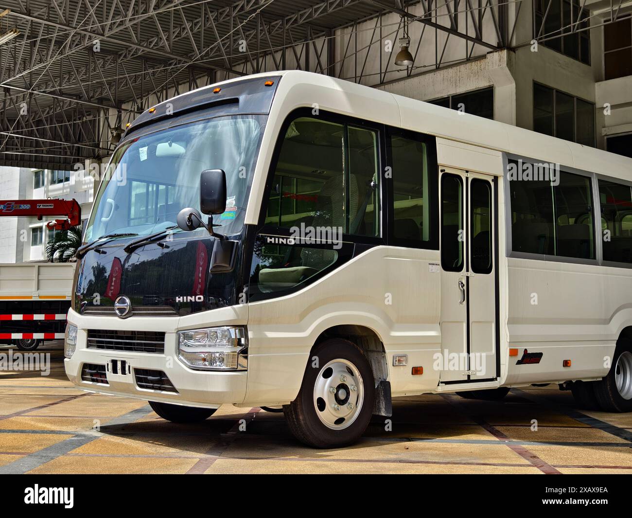 PHUKET, THAILAND- June 01, 2024: White Hino bus outside near showroom ...