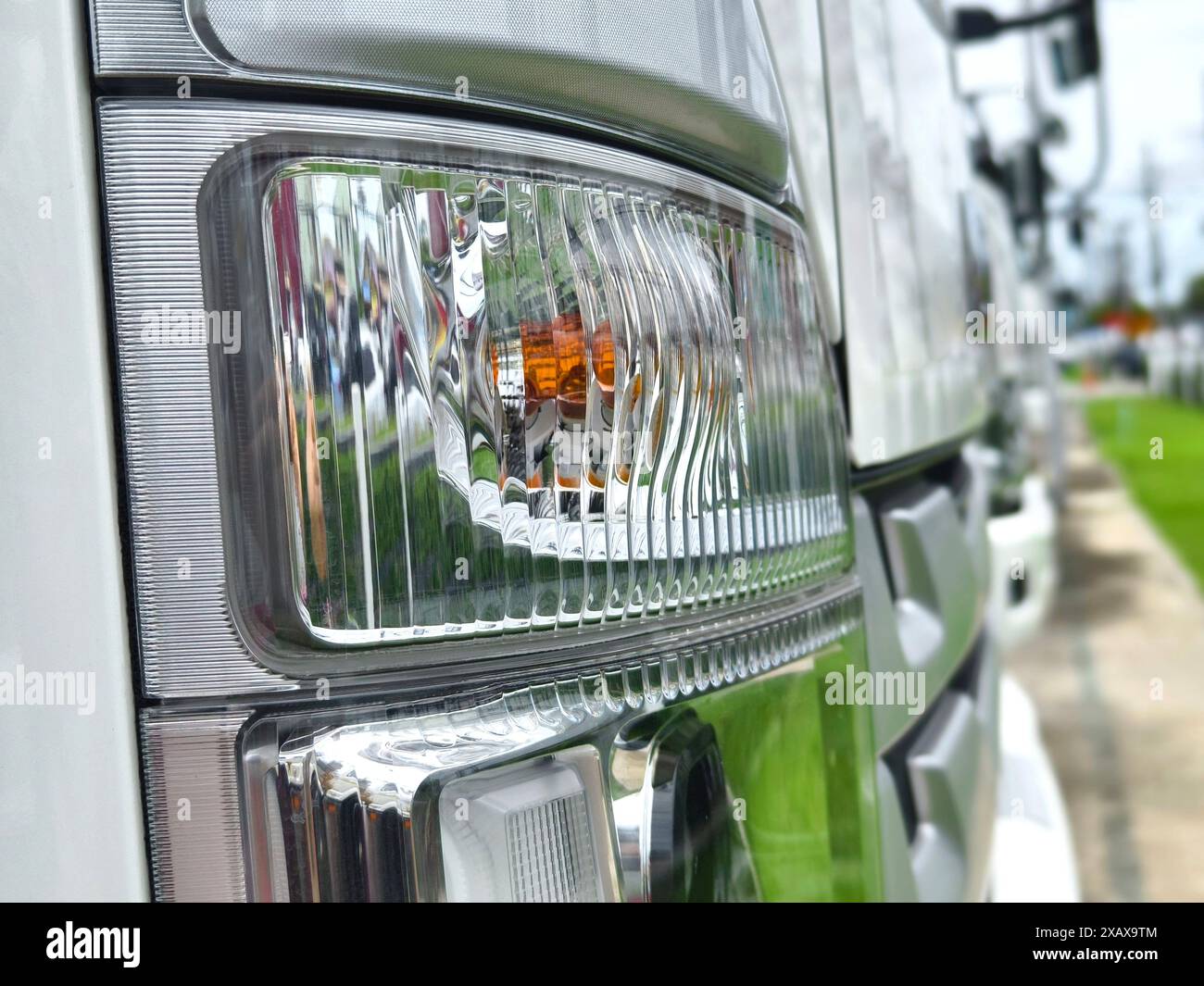Big truck headlight with grille and hood Stock Photo - Alamy