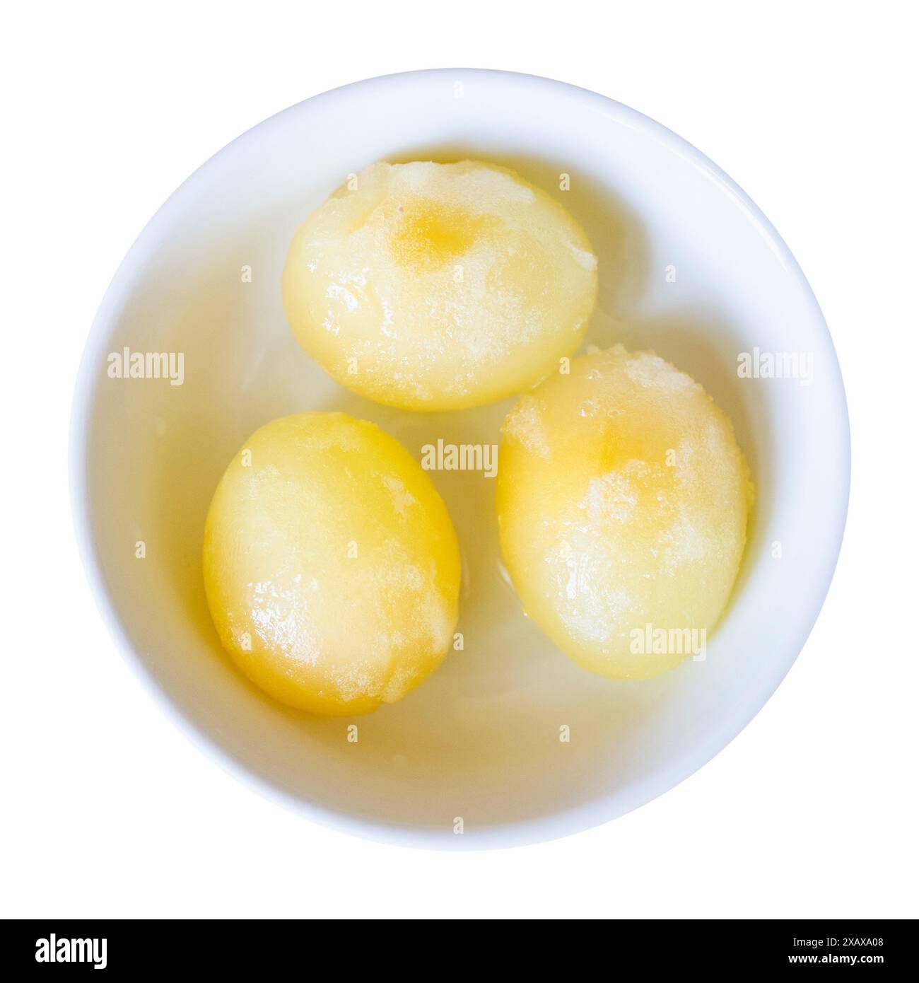 three peeled raw frozen eggs in bowl isolated on white background Stock ...