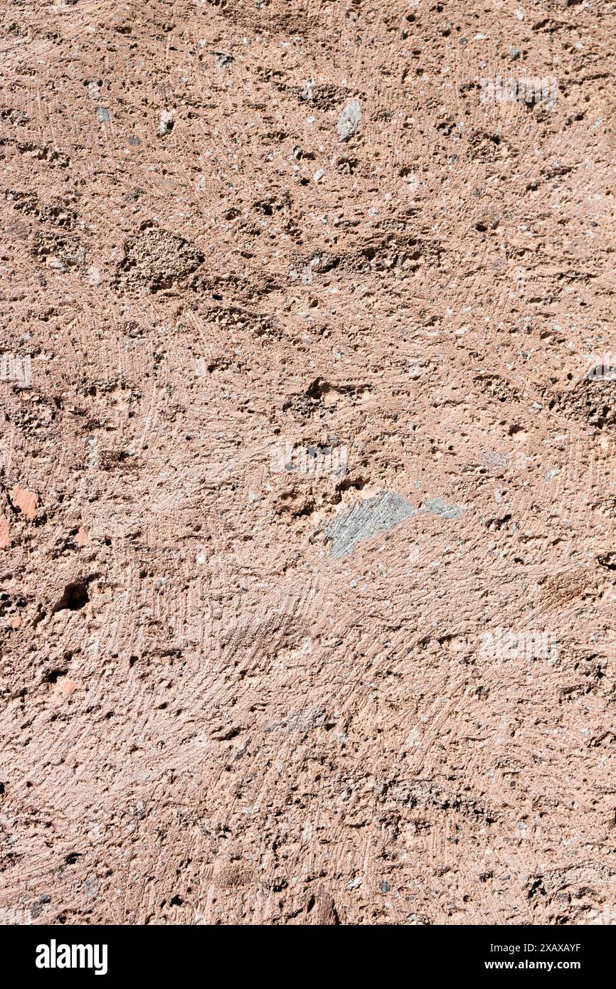 vertical textured background - surface of brown armenian tuff wall tile ...