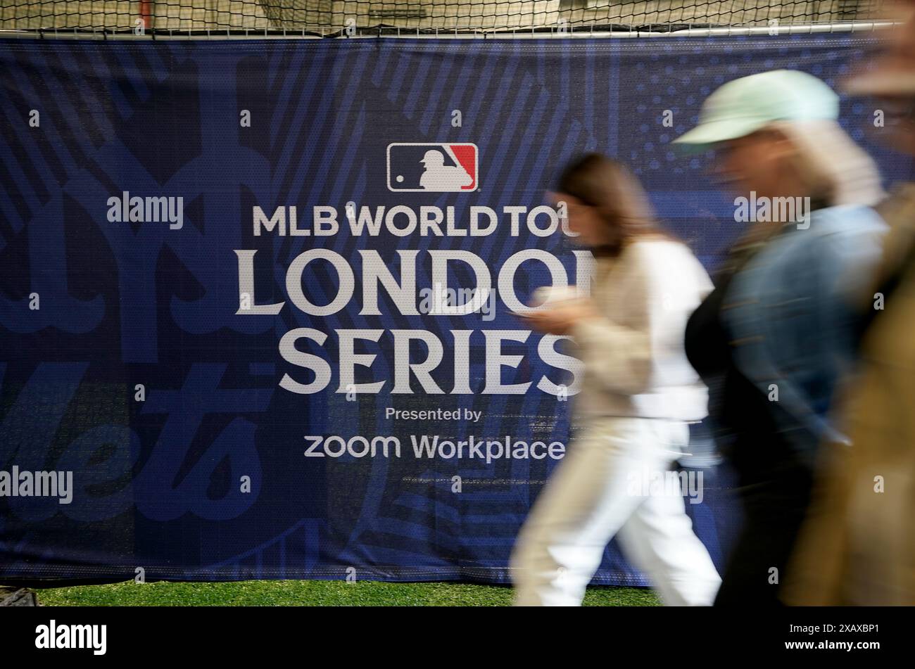 Fans walk past signage ahead of game two of the MLB London Series at ...