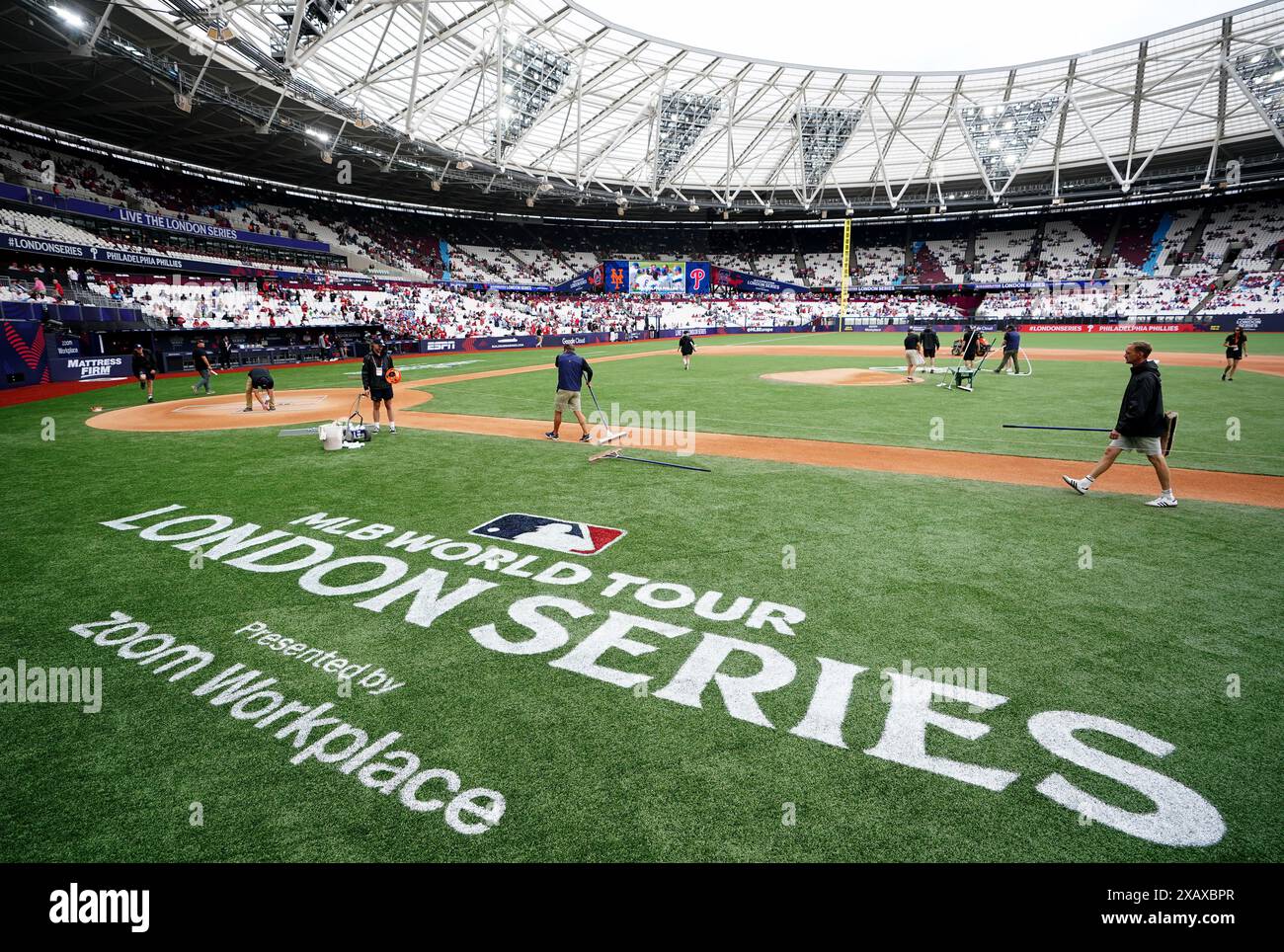 Ground staff prepare the field ahead of game two of the MLB London ...