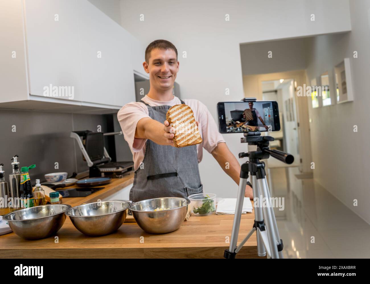 Chef cooking white bread toasted on an electric grill Stock Photo - Alamy