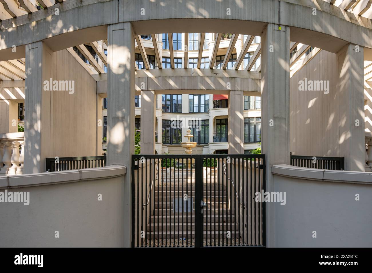 A large building with a courtyard in the middle. The courtyard has a ...