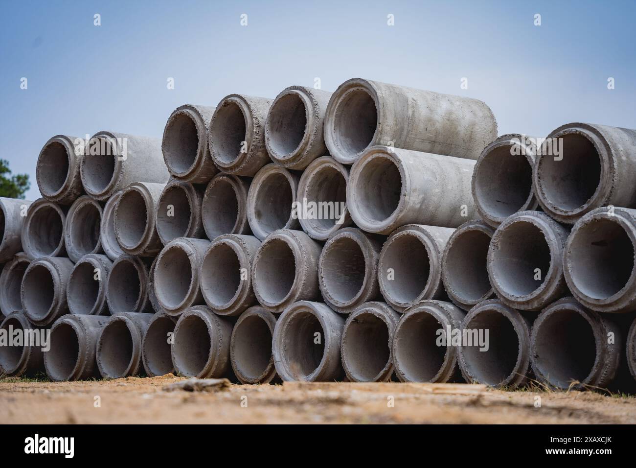 A stack of concrete ring pipes piled and creating a symmetrical ...