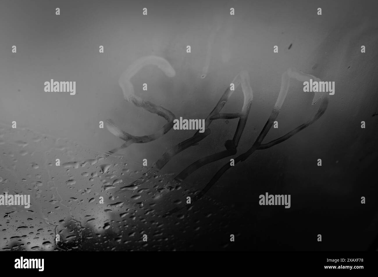 Word sad written on foggy window with rain drops Stock Photo - Alamy