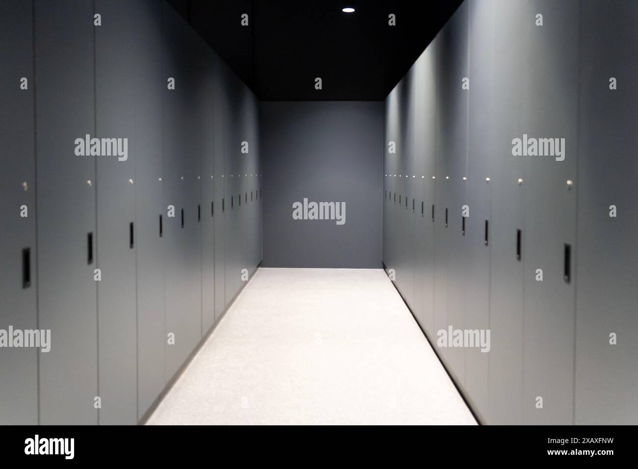 A row of closed gray cabinets in a corridor Stock Photo - Alamy