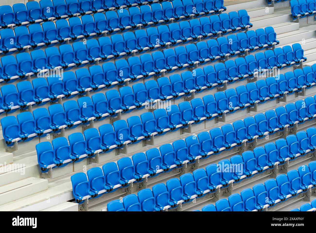 A long row of modern blue chairs with folding seats in a room Stock ...