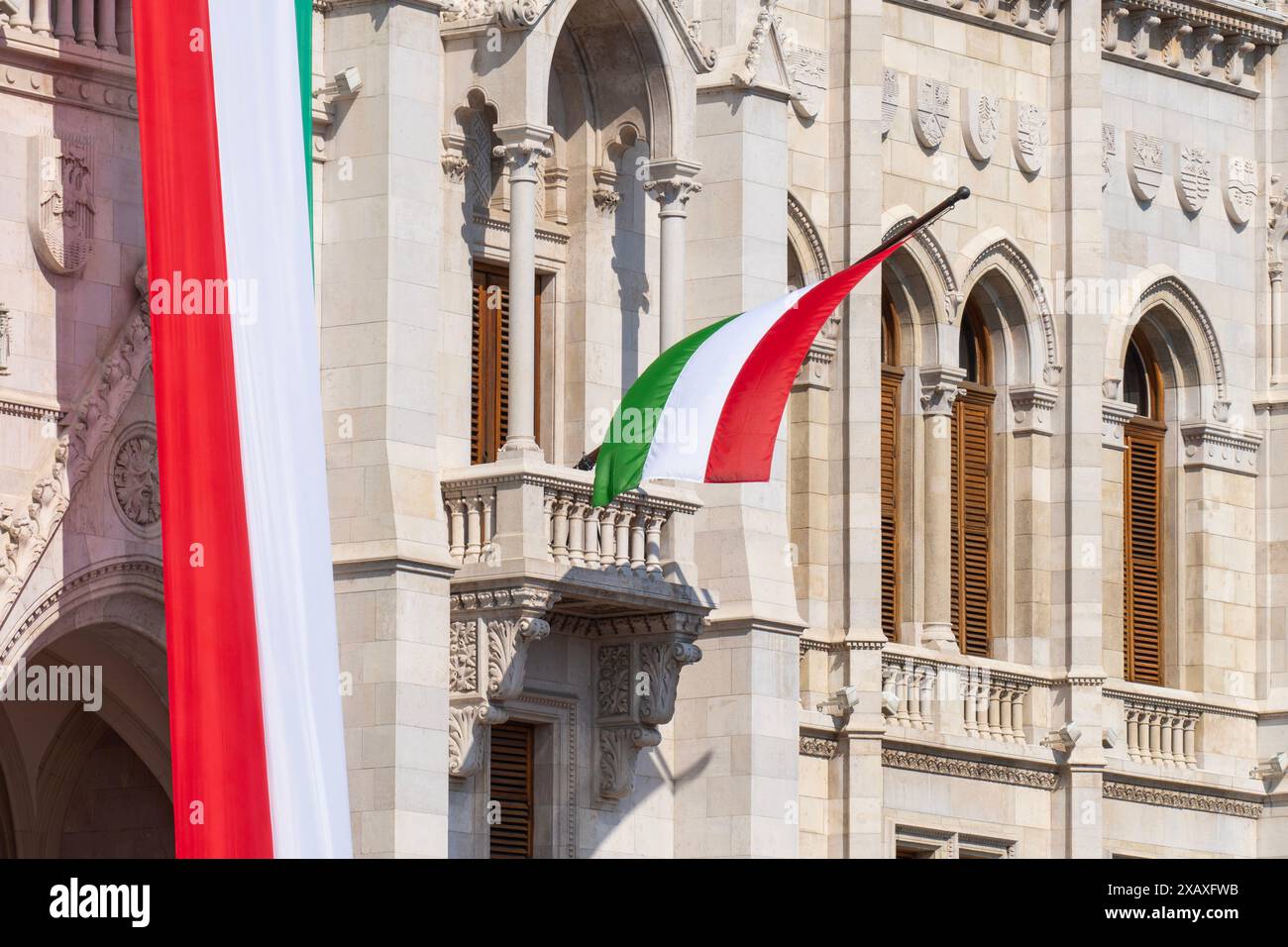 The neo-Gothic building of the Hungarian parliament, the Parliament, is decorated with flags in ...